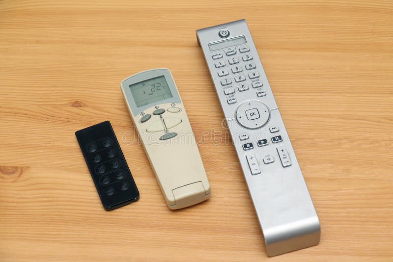 Remote controls on table stock photo. Image of device - 154124928