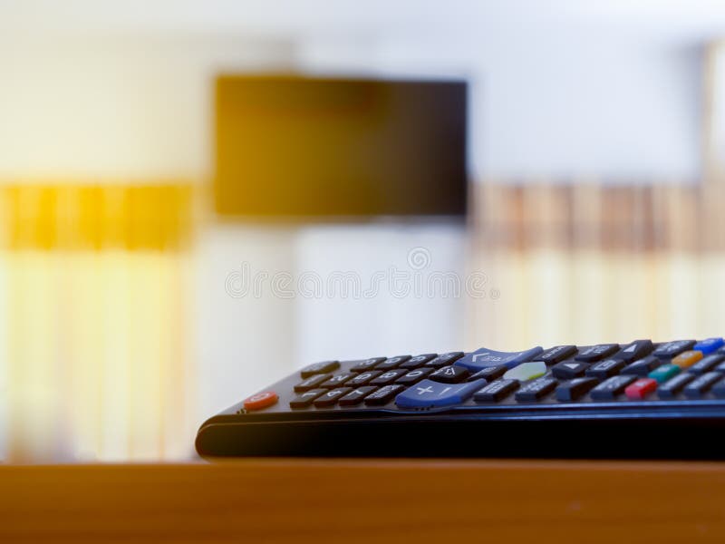 Remote Controls of TV on the Table at the Meeting Room. Flare Light ...