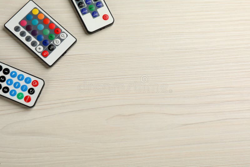 Remote Controls on White Wooden Table, Flat Lay. Space for Text Stock ...