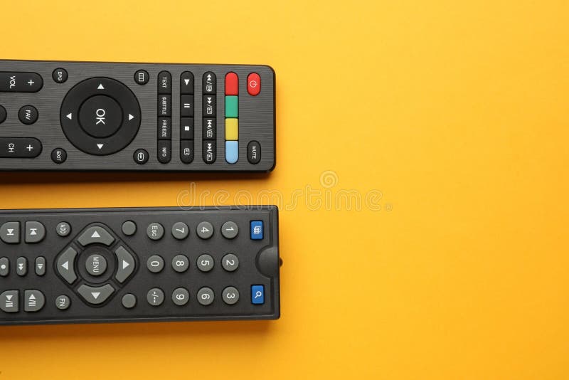 Remote Controls on Yellow Background, Flat Lay. Space for Text Stock ...