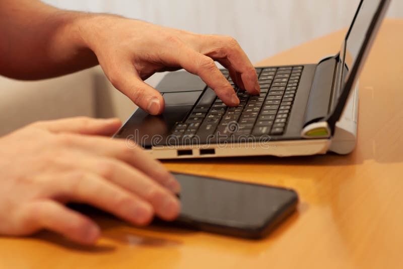 A Remote Employee Works at a Computer in a Pandemic and Self-isolation ...