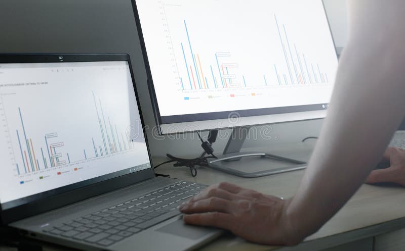 Remote Learning or Work. Man Analyzing Charts on a Computer Monitor ...