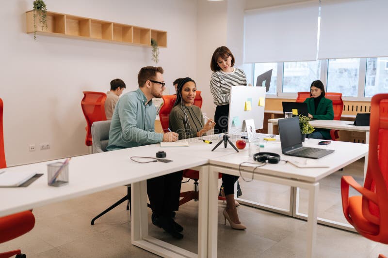 Remote View of Diverse Colleagues Working Together Discussing Computer ...