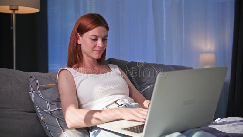 Remote Work, Charming Young Woman Working at Computer while Sitting on ...