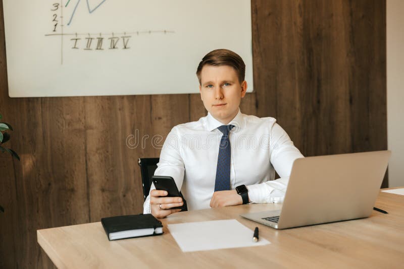 Remote Work at the Computer. Distracted from Work, a Man Looks at the ...