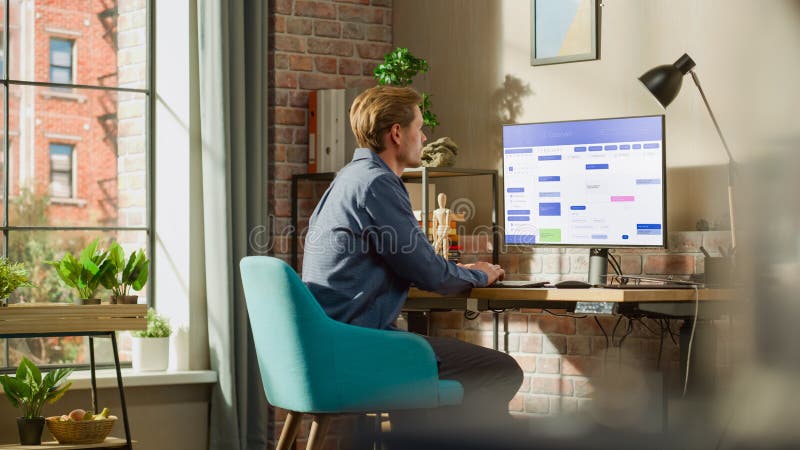 Remote Work Concept: Man Using Desktop Computer with Office Software To ...