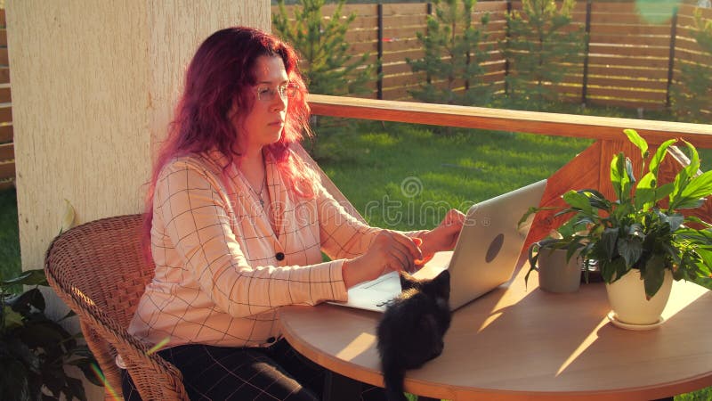 Remote Work Concept. Young Woman Working on Her Computer on a Terrace ...