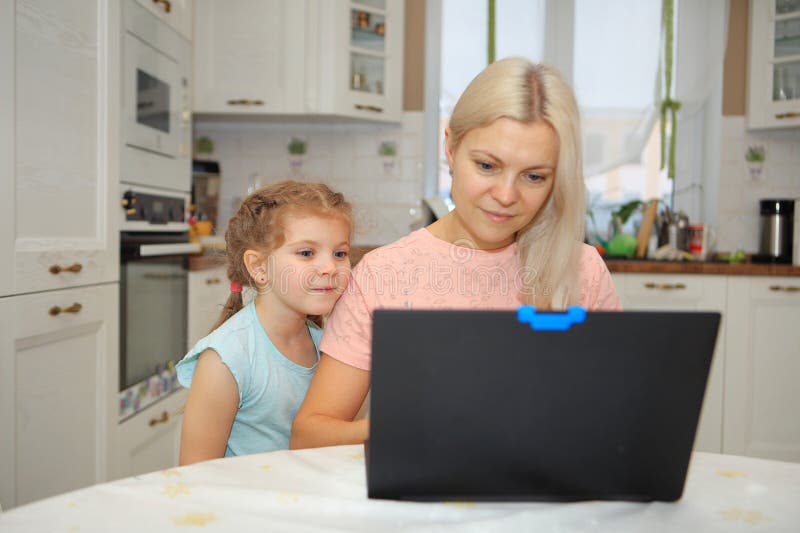 Remote Work and Quality Time: a Mother-Daughter Moment Stock Photo ...