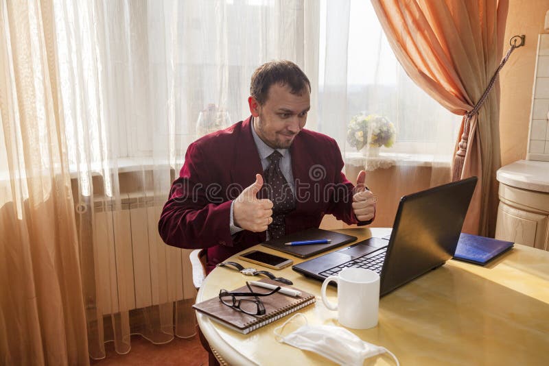 Remote Work, Sitting at the Kitchen Table, a Young Man in a Business ...