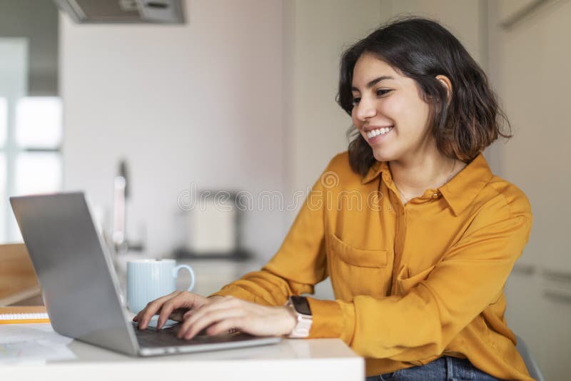 Remote Work. Young Arab Female Freelancer Working with Laptop in ...