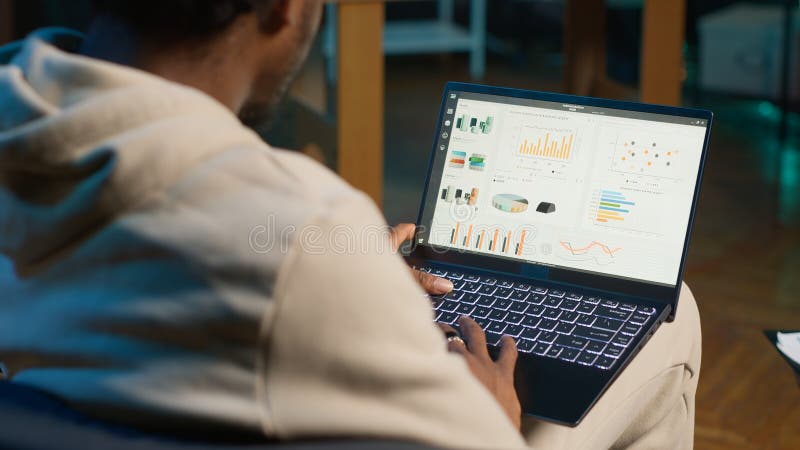 Remote Worker Accountant Doing Math Calculations Using Financial Graphs ...