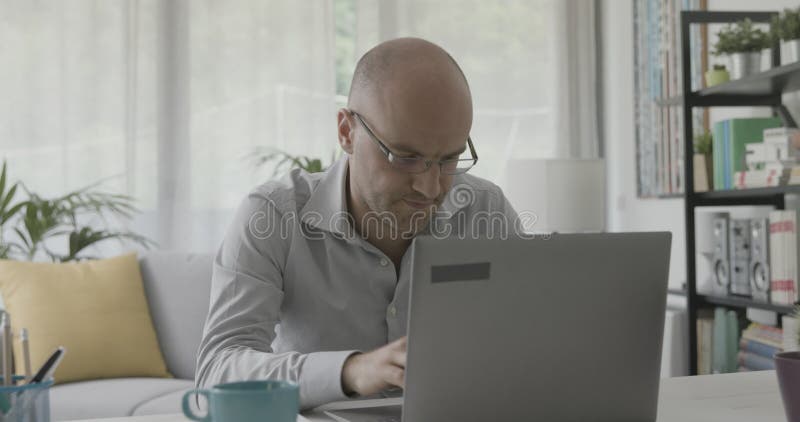 Remote Worker Sitting at Desk and Connecting with a Laptop Stock ...