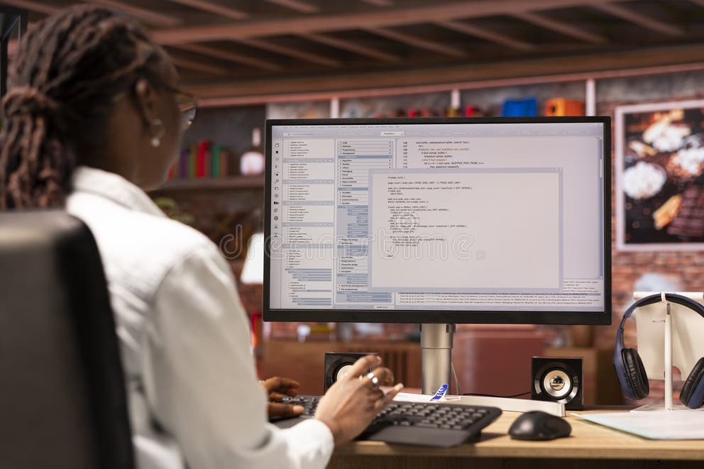 Remotely Working Engineer in Home Office Coding on Computer Monitor ...