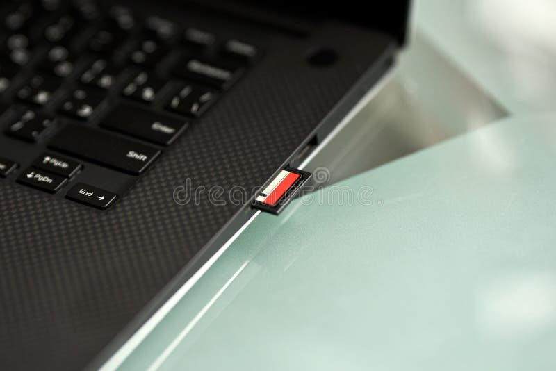 A Removable Flash Drive is Connected To the Laptop To Read Information ...