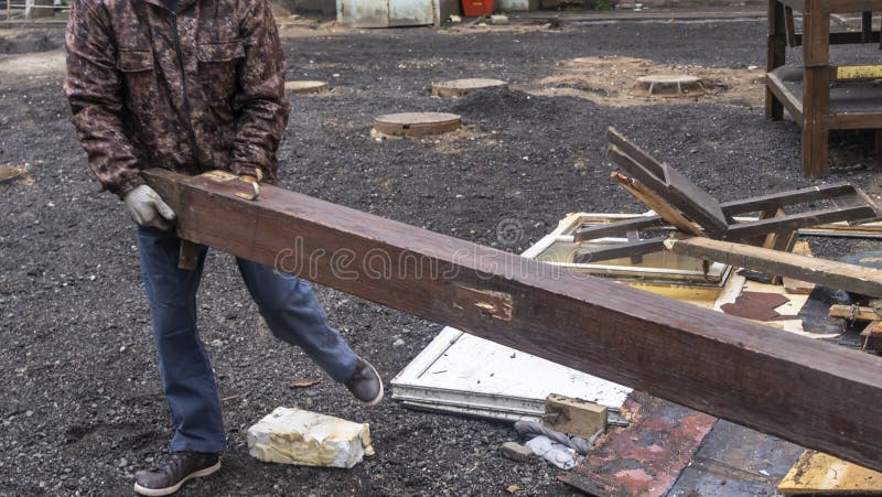 Removal of Construction Debris. Loading the Garbage Can Waste ...