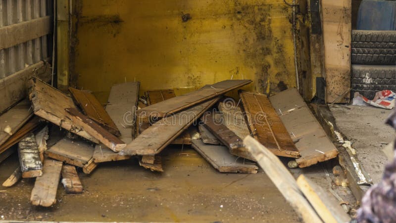 Removal of Construction Debris. Loading the Garbage Can Waste ...