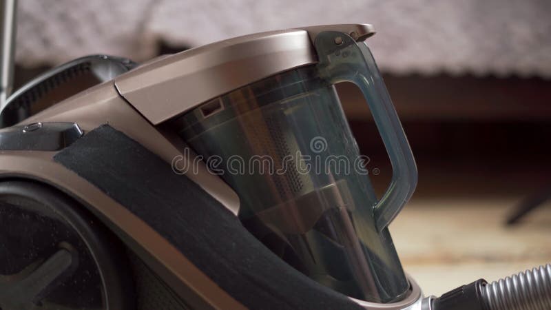 Remove the Container from the Vacuum Cleaner after Cleaning the House ...