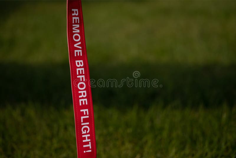 Remove before flight stock image. Image of grass, items - 280040907