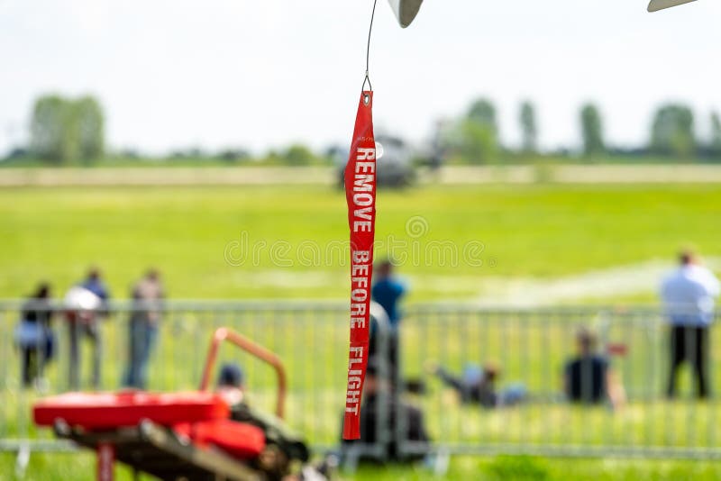 A Remove before Flight Ribbon on a Jet Airplane. Stock Image - Image of ...