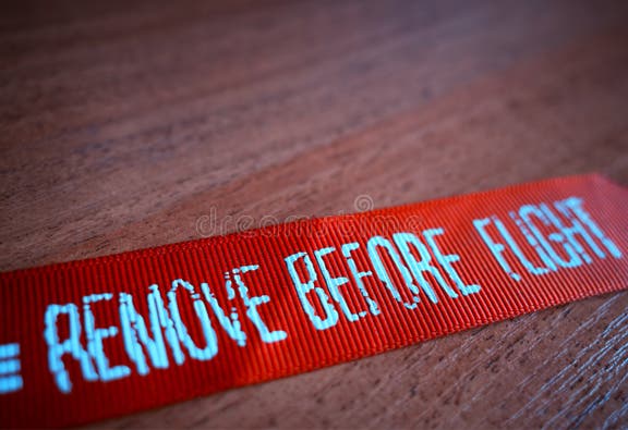 `Remove before Flight` Ribbon from Pilot Jacket Background Stock Photo ...