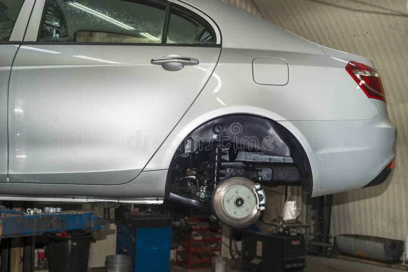 Remove the Wheel from the Vehicle on a Lift Stock Image - Image of door ...