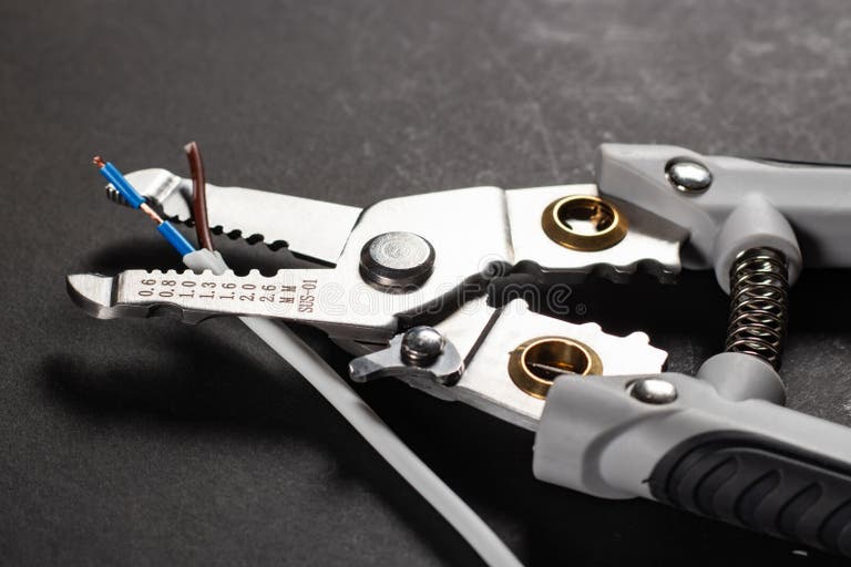 Removing the Insulation from the Conductor Using a Tool. Wire Stripping ...