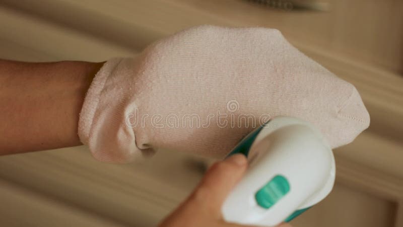 Removing Lint from a Pink Sock Stock Video - Video of cotton, electric ...