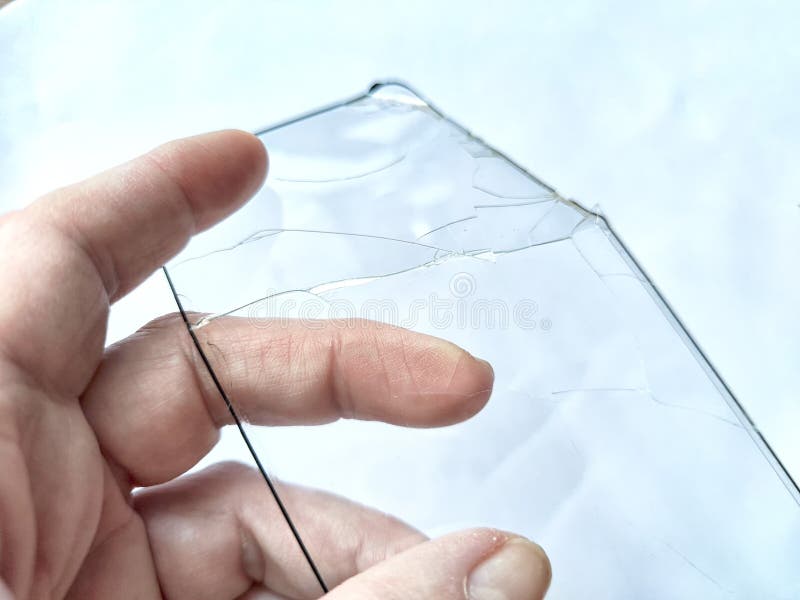 Removing Protective Film from a Cracked Screen. Peeling Off a Cracked ...