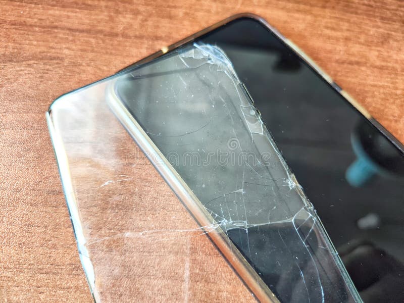 Removing Protective Film from a Cracked Screen. Peeling Off a Cracked ...