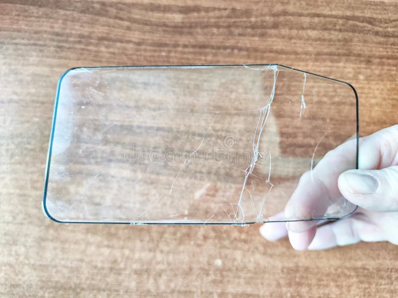 Removing Protective Film from a Cracked Screen. Peeling Off a Cracked ...