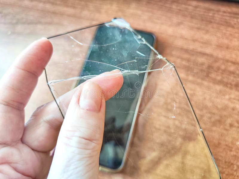 Removing Protective Film from a Cracked Screen. Peeling Off a Cracked ...