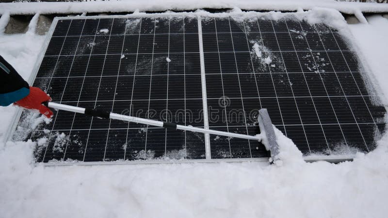 Removing Snow from the Solar Panel. the Solar Element Under the Snow.3 ...
