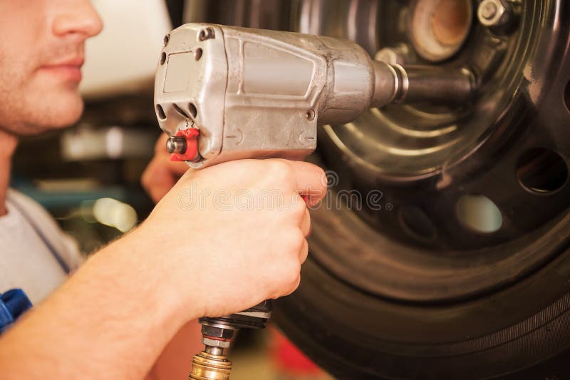 286 Man Removing Car Tire Stock Photos - Free & Royalty-Free Stock ...