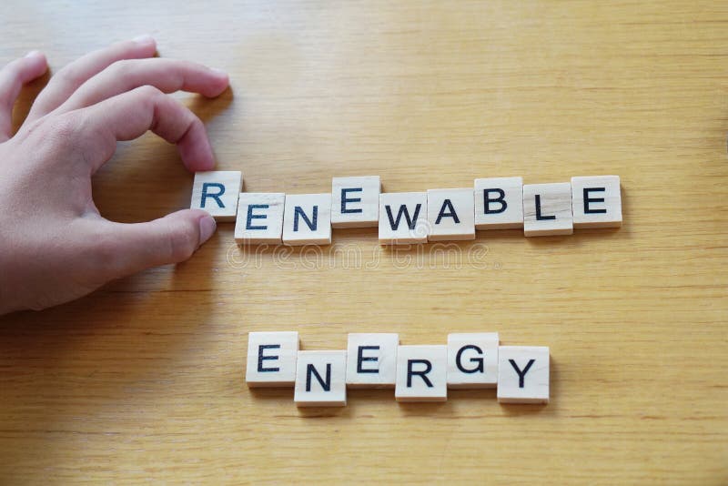 Renewable Energy. Hand Placing Wooden Letters Stock Image - Image of ...