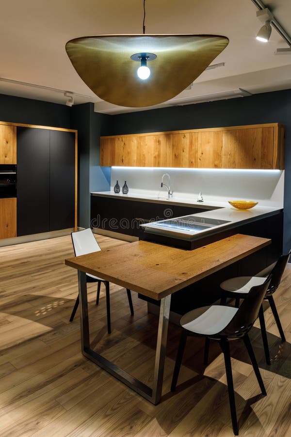 Renovated Kitchen Interior with Large Lamp Over Table Stock Photo ...