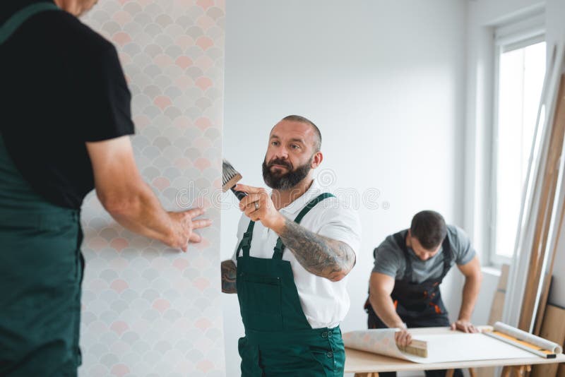 Renovation Crew of Three Builders Remodeling Bright Apartment Stock ...