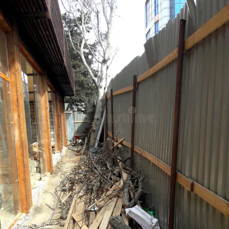 Renovation of an Old House. Tree Branches and Various Debris Piled Up ...