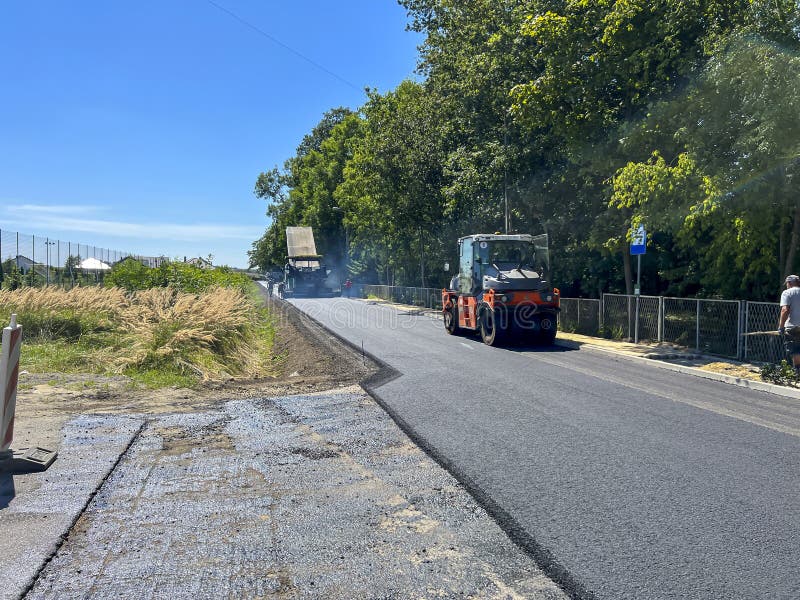 Renovation of a Village Road, Making a Layer of Asphalt Stock Image ...