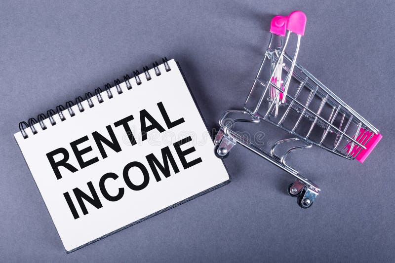 RENTAL INCOME Text on a Notebook with Mini Shopping Trolley Stock Image ...