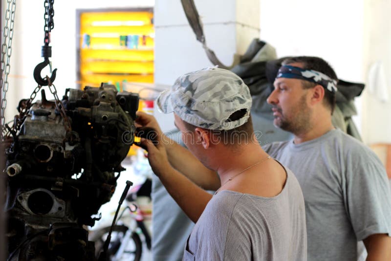Repair of the Adopted Car Engine by Two Men Stock Image - Image of ...