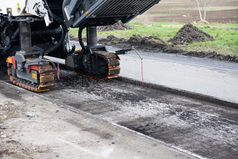 Repair of an Asphalt Road with Fresh Asphalt Stock Image - Image of ...