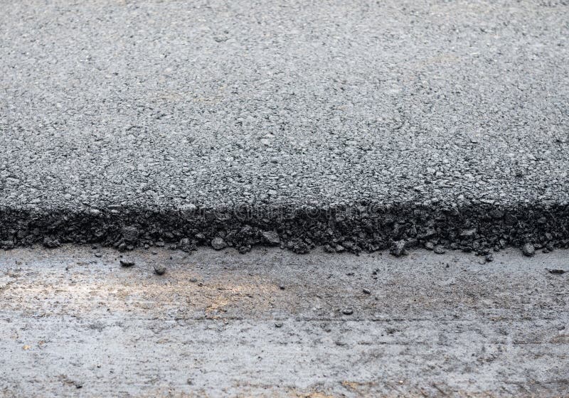 Repair of an Asphalt Road with Fresh Asphalt Stock Photo - Image of ...
