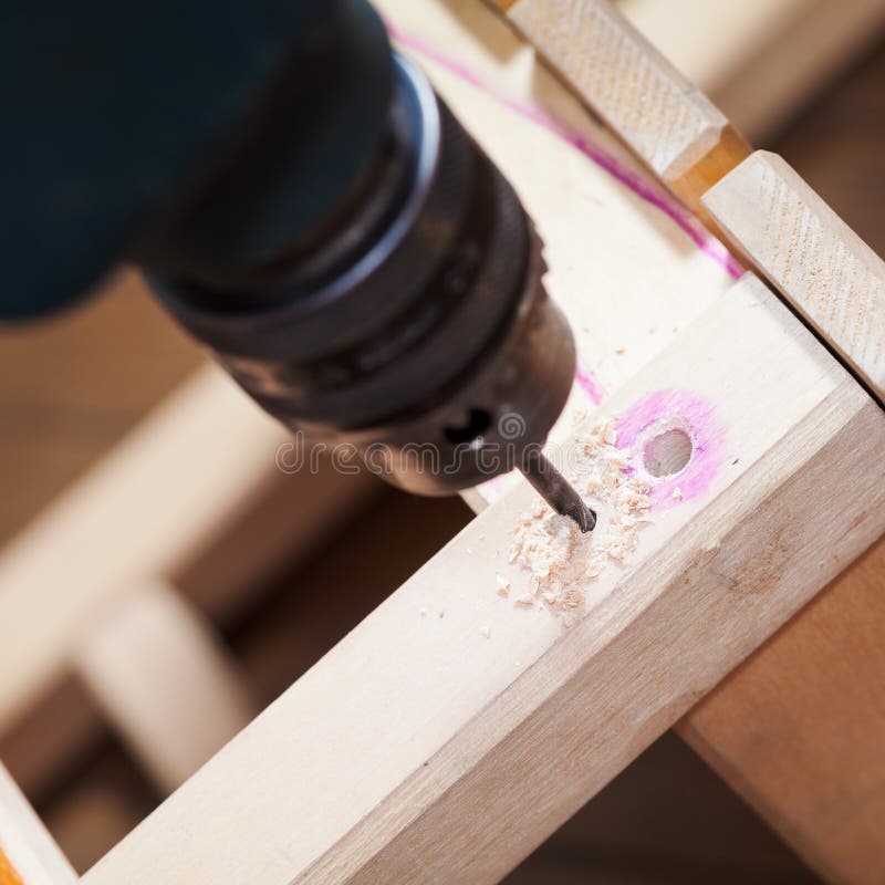 Repair chair with drill stock image. Image of assembling - 32027945