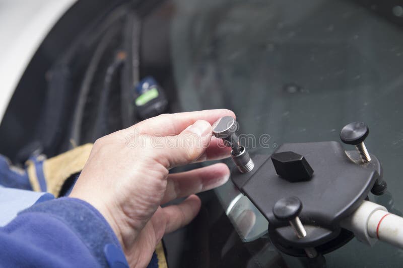 Repair of Chips and Cracks on the Windshield of the Car Stock Image ...