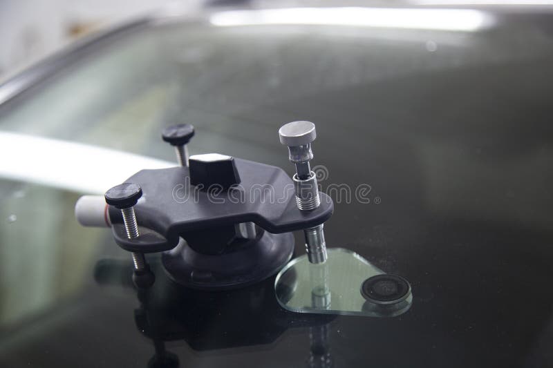 Repair of Chips and Cracks on the Windshield of the Car Stock Photo ...