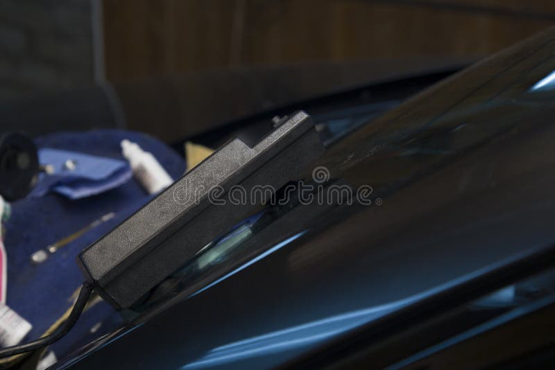 Repair of Chips and Cracks on the Windshield of the Car Stock Photo ...
