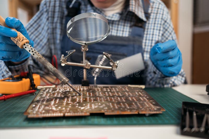 Repair of Computers or Electronics by a Foreman in a Workshop. Manual ...