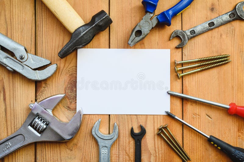 Repair and Construction Tools Lie on a Wooden Table Around a White ...