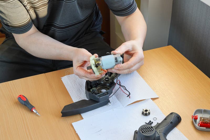 Repair of Electrical Tools, Engine Replacement in Chain Saw Stock Photo ...