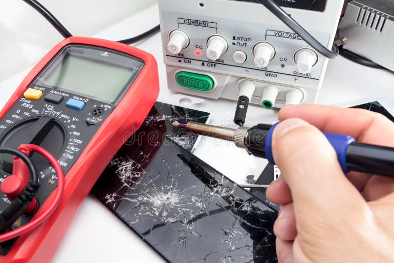 Repair of Electronic Devices, Soldering of Parts. Multimeter Stock ...